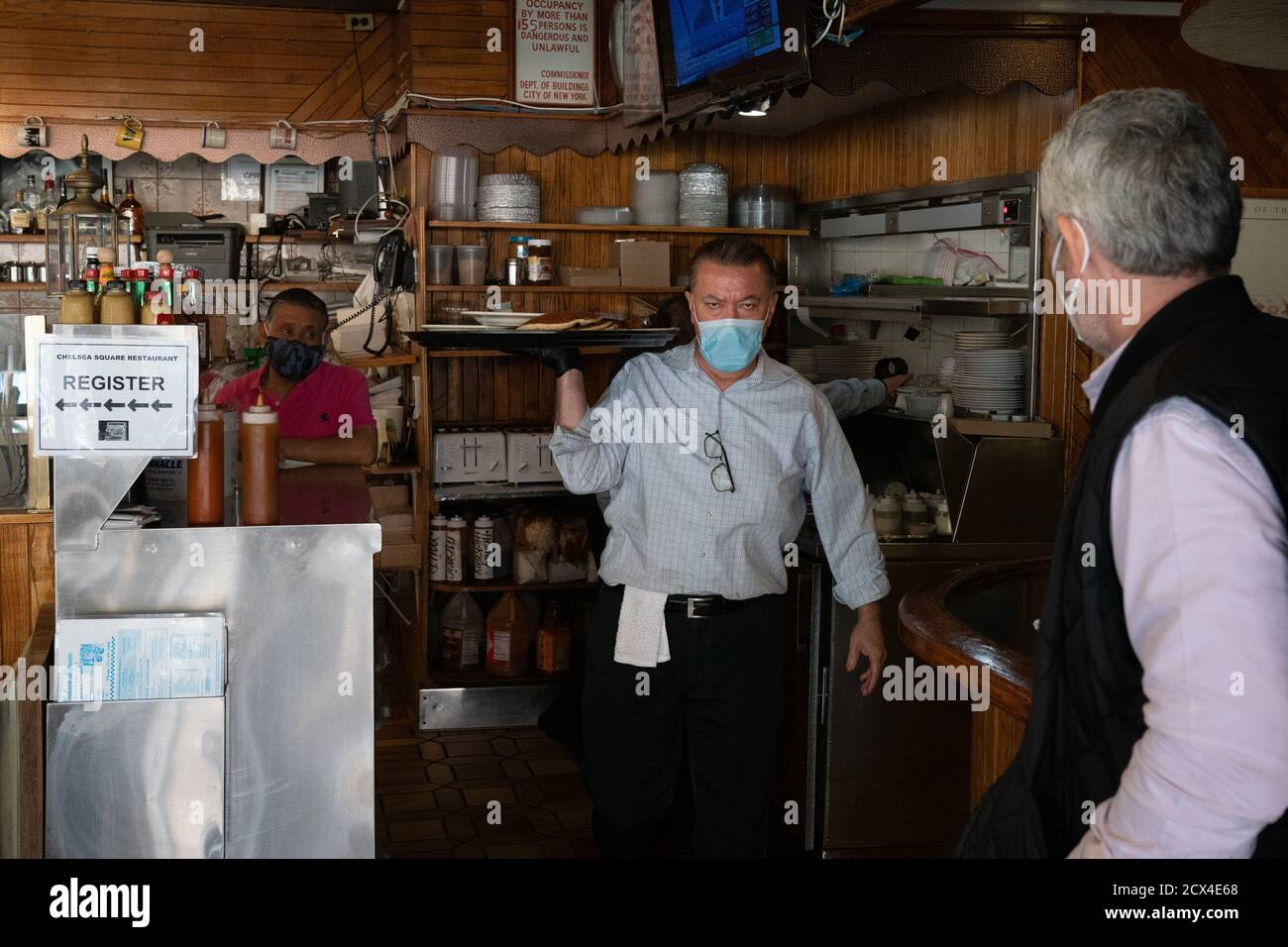 New York, New York, USA. 30th Sep, 2020. Employees wear masks inside ...