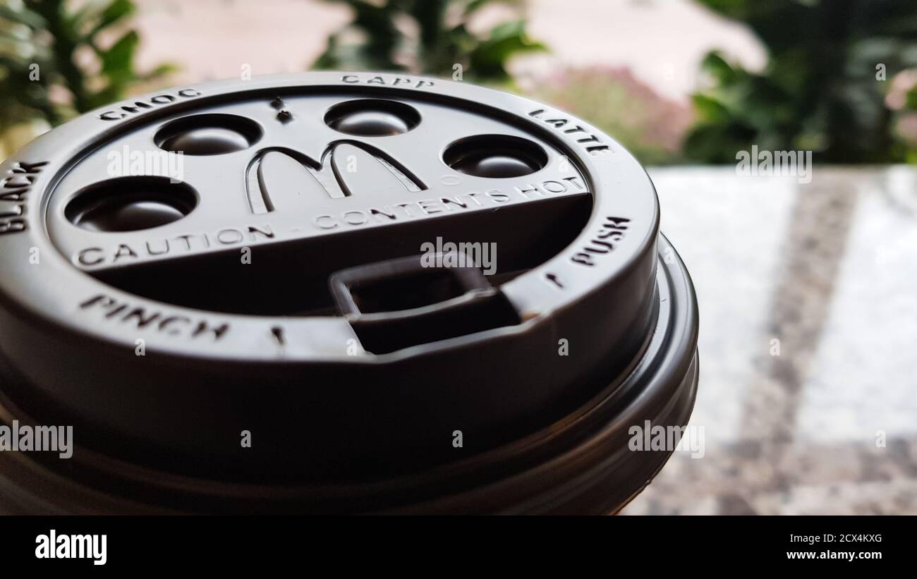 Close-up of McDonald's fast food restaurant logo on a black paper cup ...
