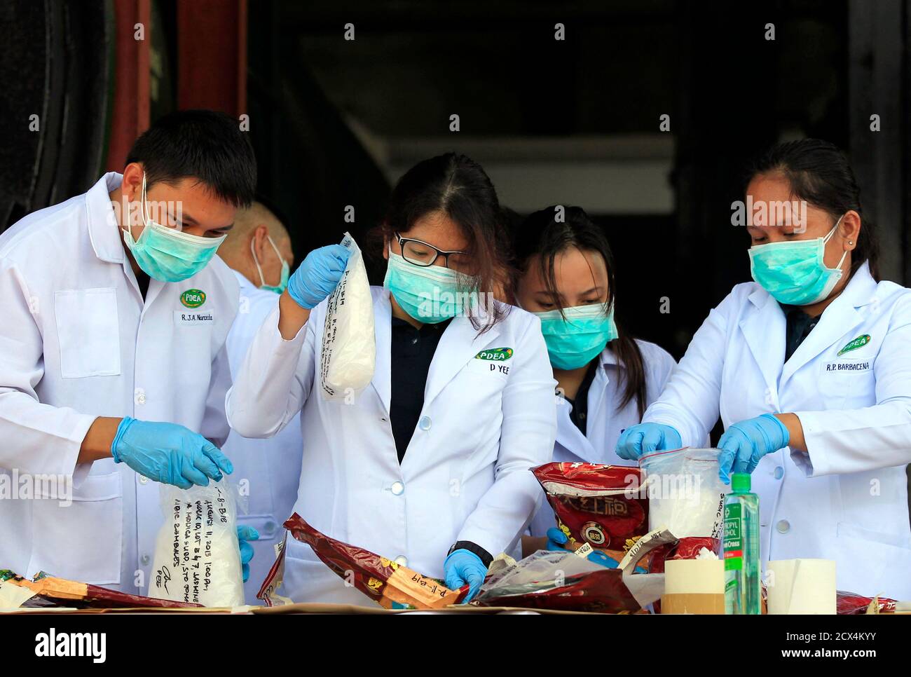 Chemists who work at the Philippine Drug Enforcement Agency (PDEA) take ...