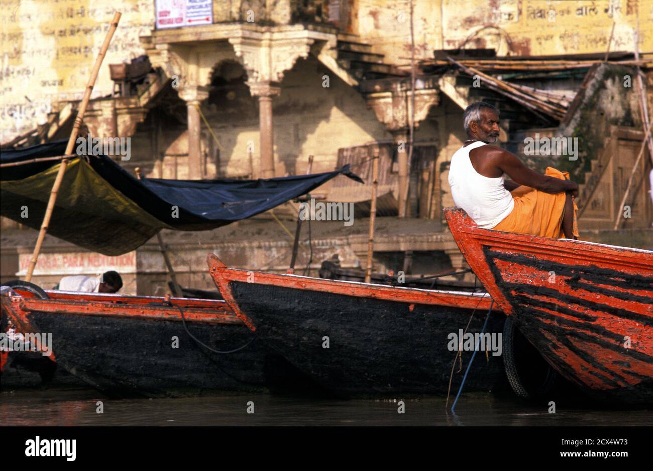 Boatman on his vessel. Beside the ghats on the Ganges. Varanasi. India ...