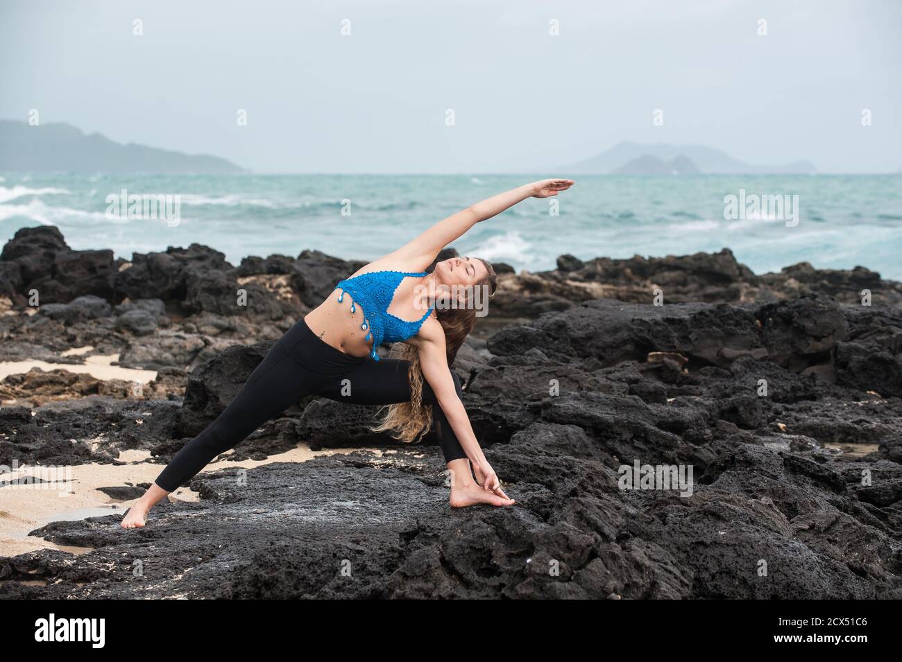 Yoga at the beach Stock Photo - Alamy