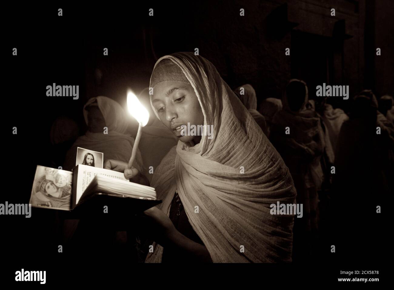 Ethiopian woman praying and celebrating Fasika in the church of Bet ...