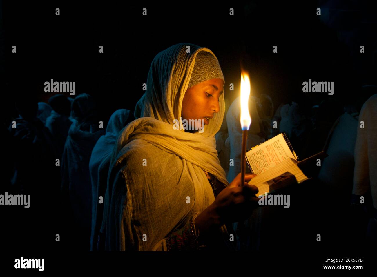 Ethiopian woman praying and celebrating Fasika in the church of Bet ...