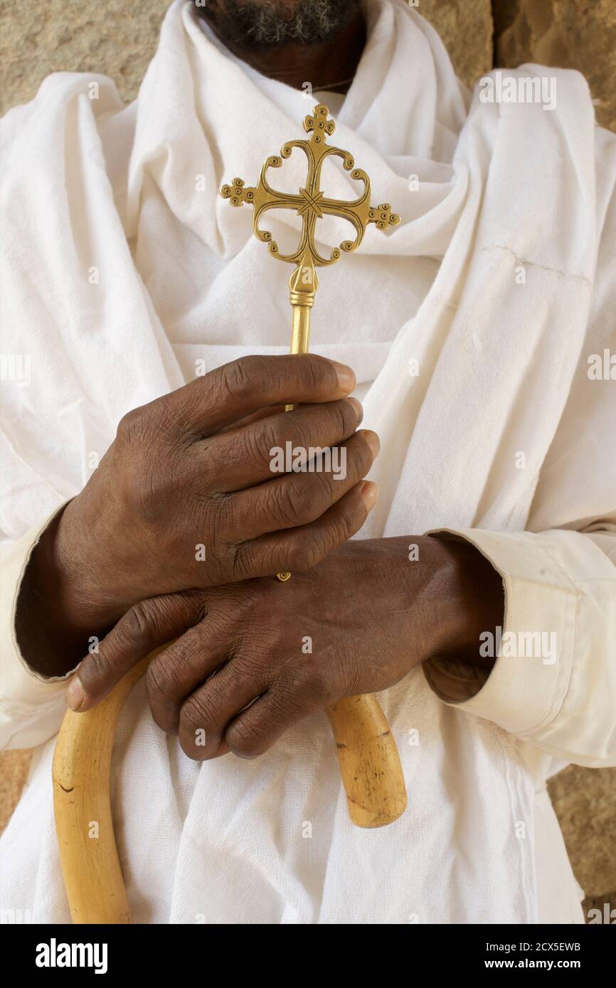 Ethiopian priest, Yeha monastery, Tigray, Ethiopia. Detail of crucifix ...