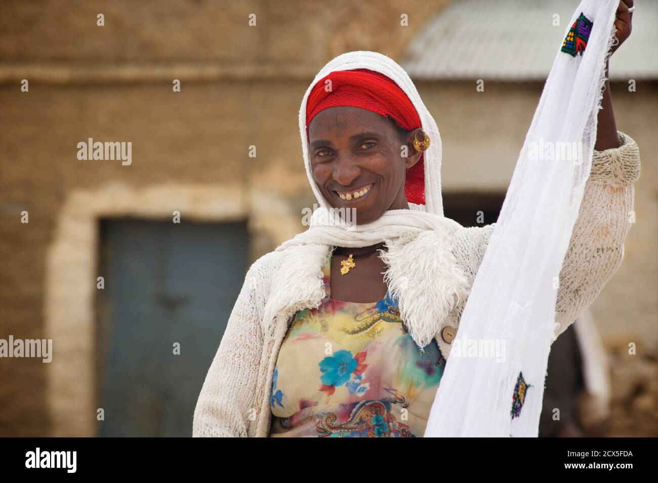 Portrait of fabrics vendor. Market day at Freweyni also known as ...