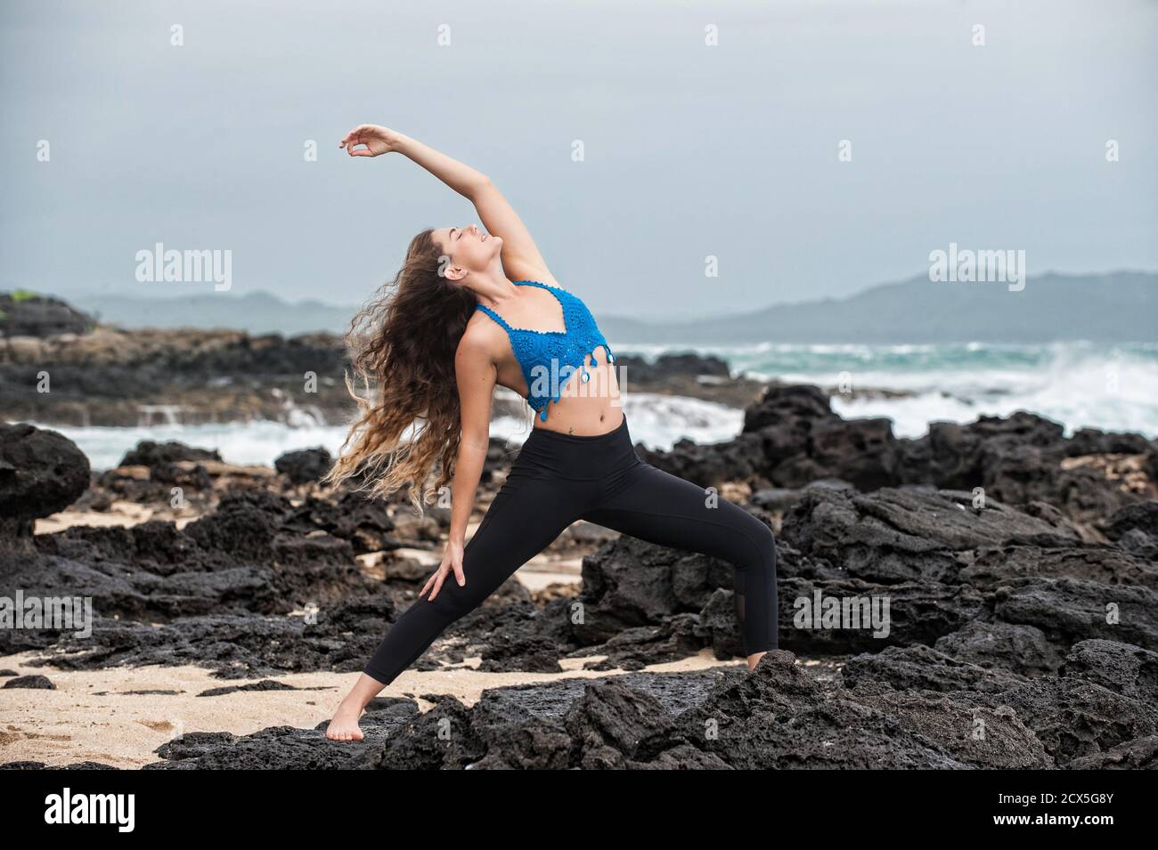 Yoga at the beach Stock Photo - Alamy