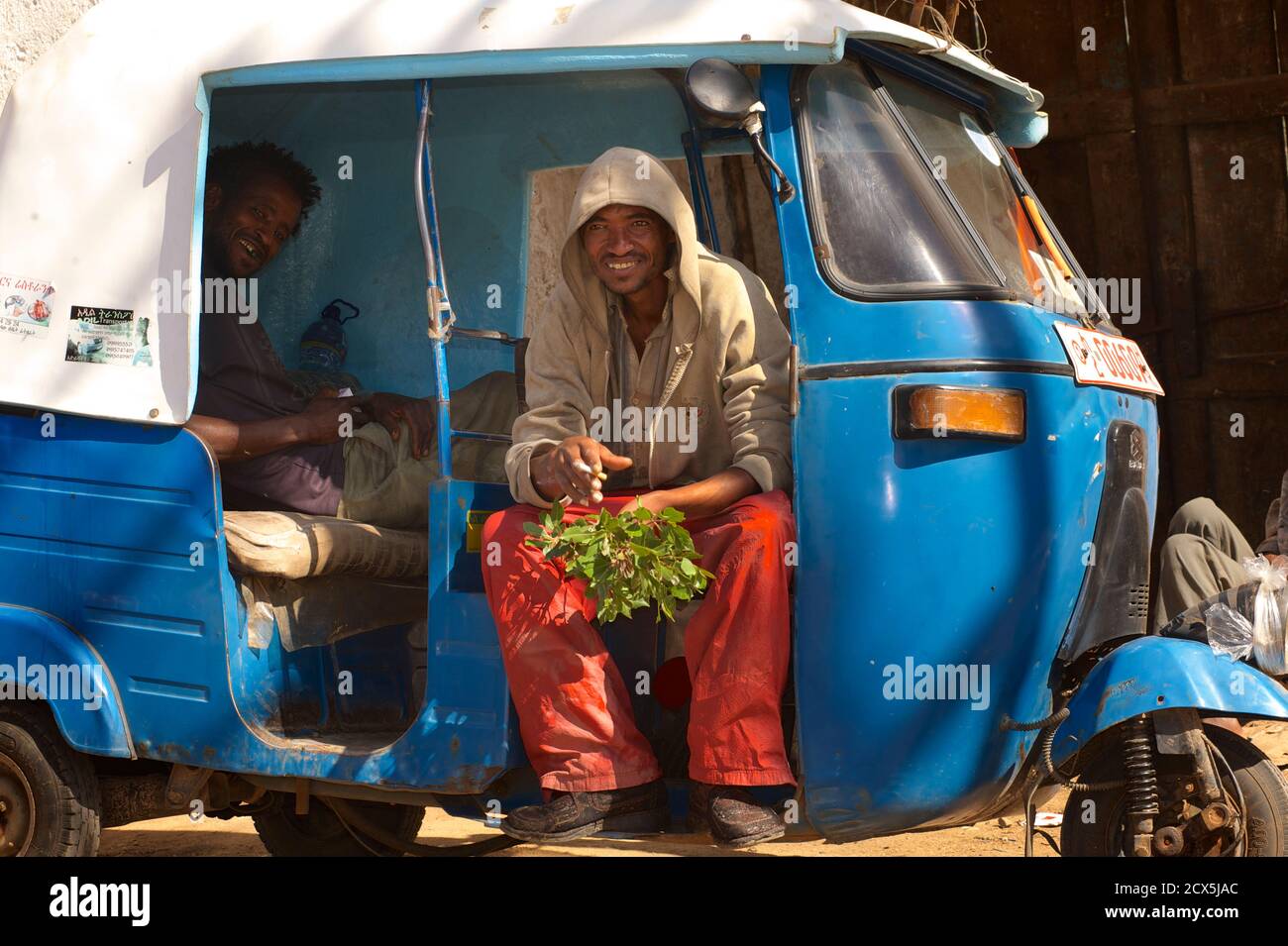 Ethiopian men sitting chewing khat, Harar, Ethiopia. Using khat as a ...