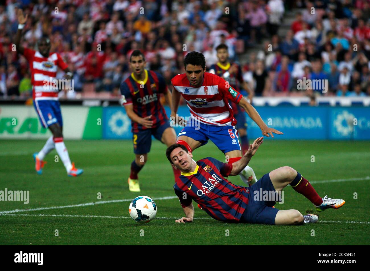 Barcelonas lionel messi falls during hi-res stock photography and ...