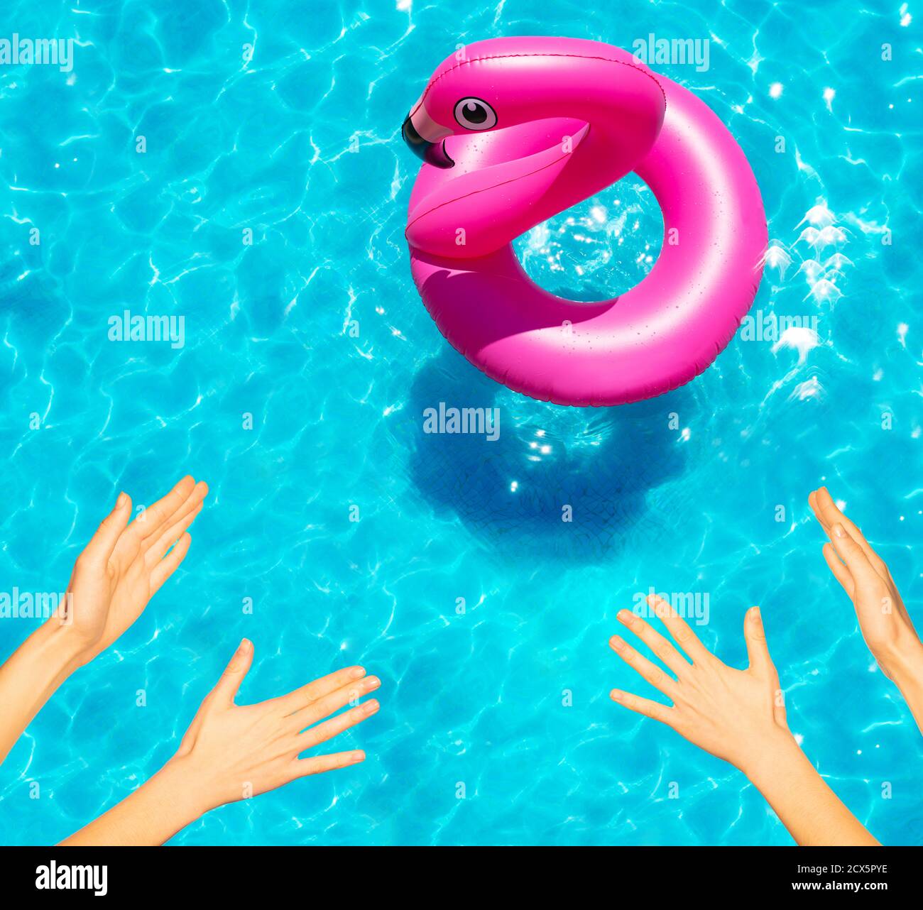 Many hands and inflatable flamingo buoy swim in the swimming pool view ...