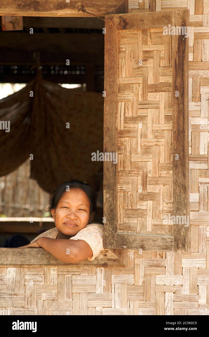 Burmese Woman In The Window Of Her Home Near Monywa Sagaing Region
