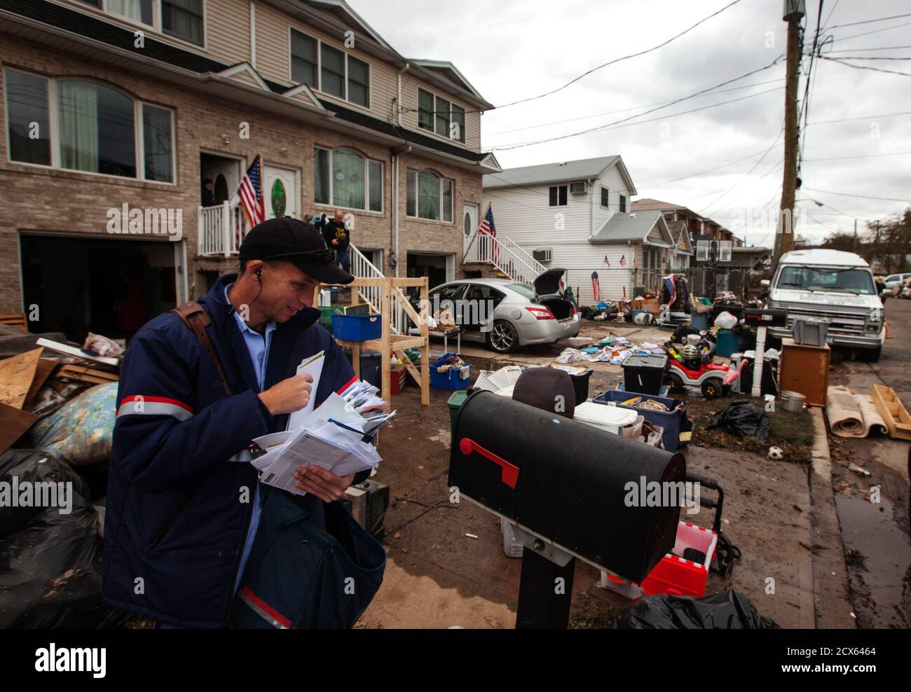 Mailman delivers neighborhood hi-res stock photography and images - Alamy