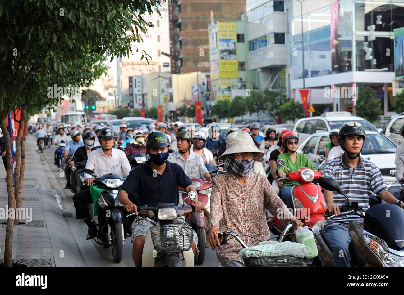 Busy street scene in central Ho Chi Minh City (Saigon). Motorcycle ...