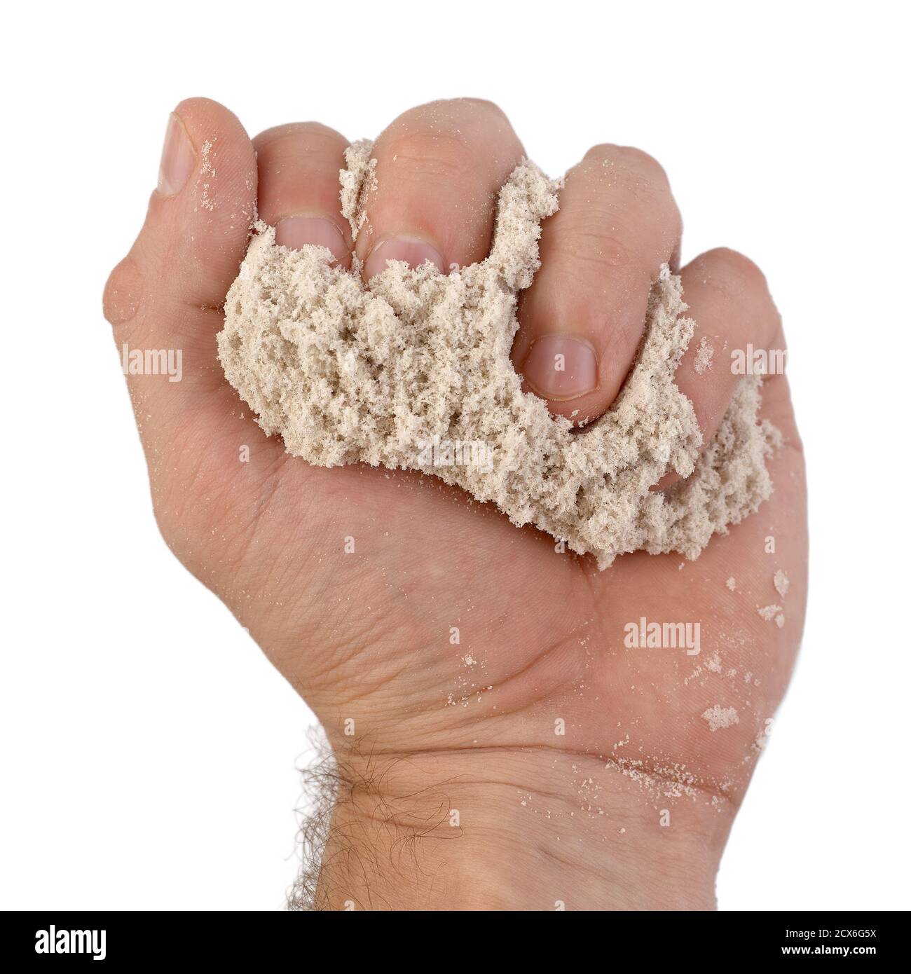 Hand and kinetic sand isolated on white background Stock Photo - Alamy