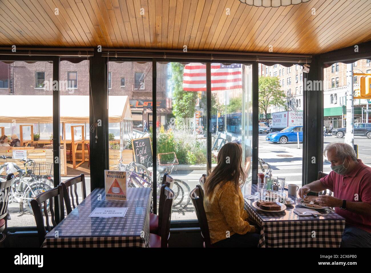 New York, New York, USA. 30th Sep, 2020. A couple eats lunch indoors at ...