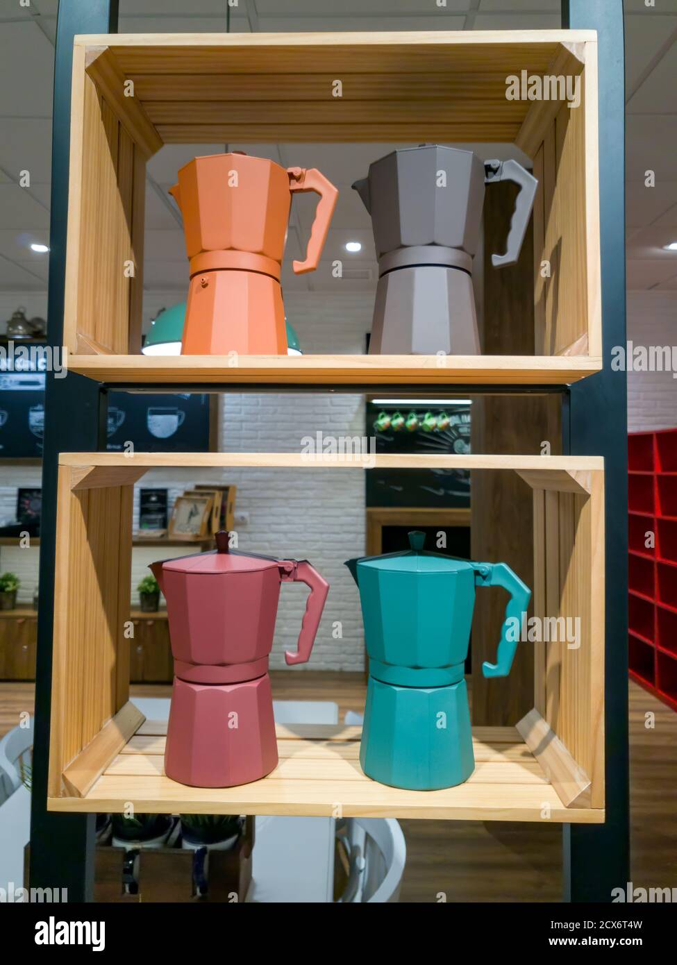 Exhibition of cute traditional colored coffee makers Stock Photo - Alamy