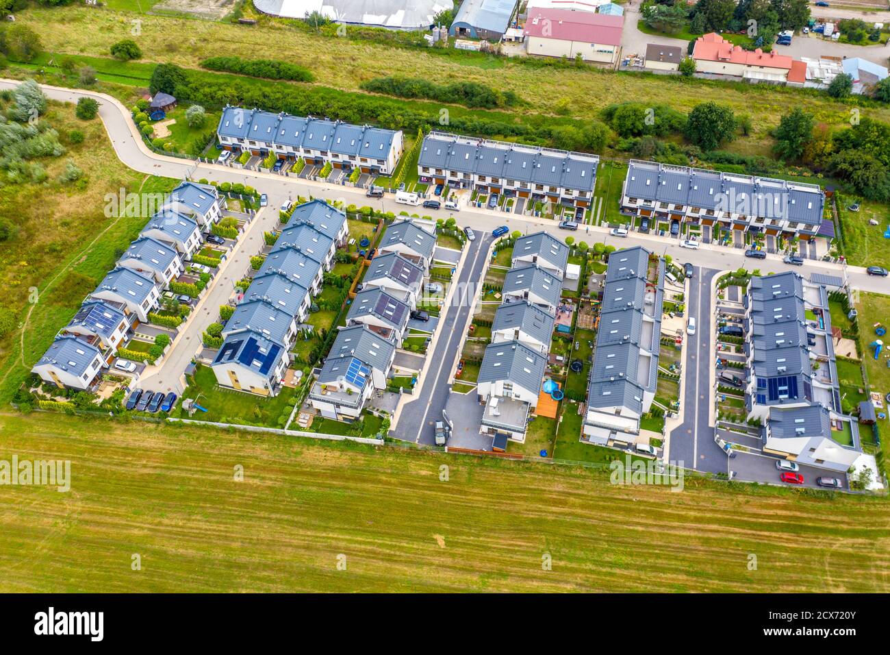 Aerial view of residential houses and driveways neighborhood. Tightly ...