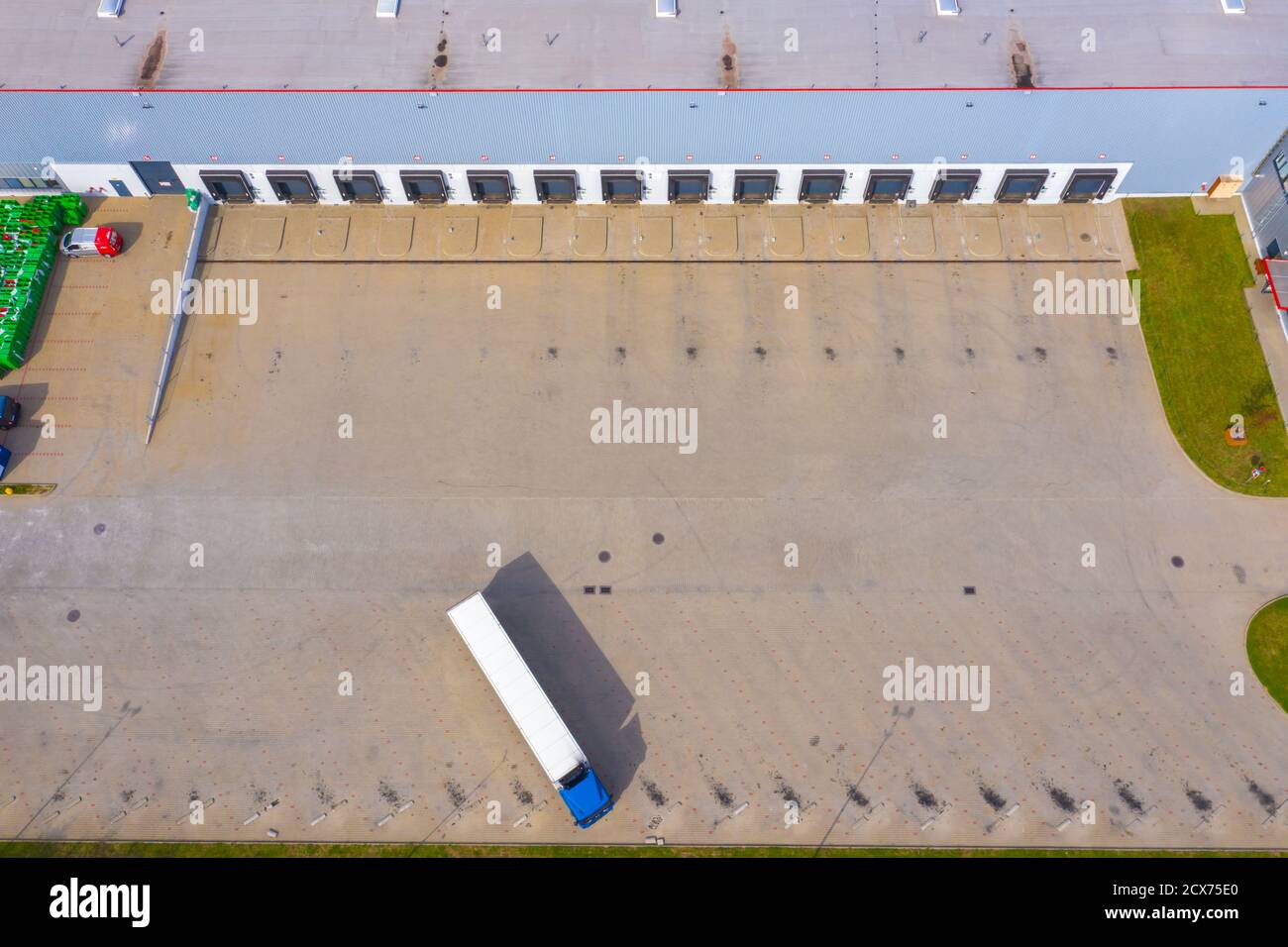 Aerial view of warehouse with trucks. Industrial background. Logistics ...