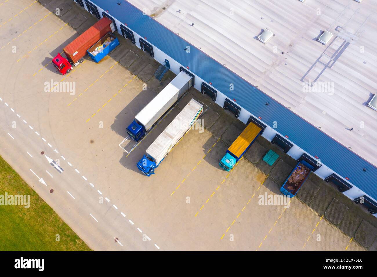 Aerial view of warehouse with trucks. Industrial background. Logistics ...