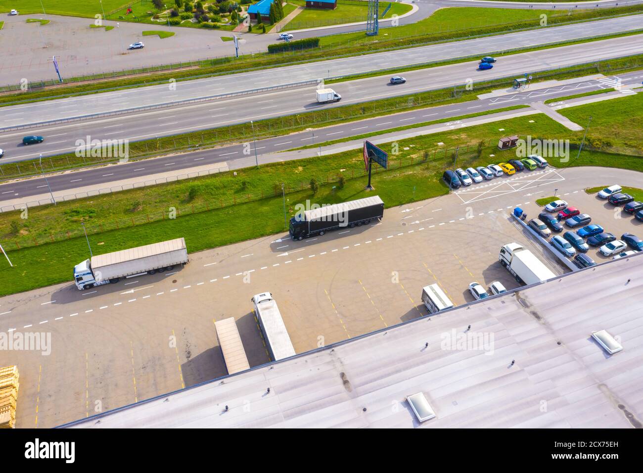 Aerial view of warehouse with trucks. Industrial background. Logistics ...