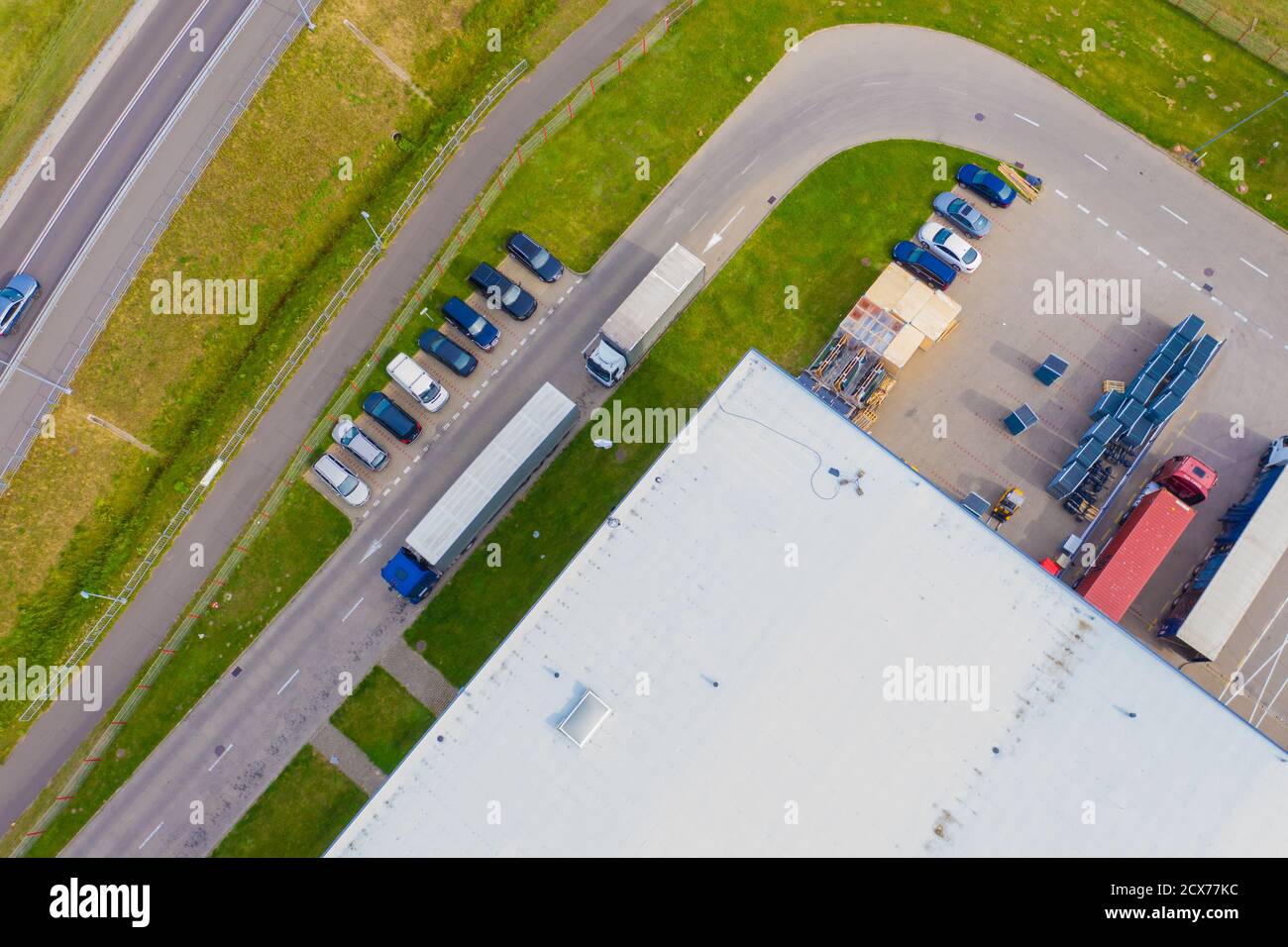 Aerial drone view of group of large modern industrial warehouse or ...