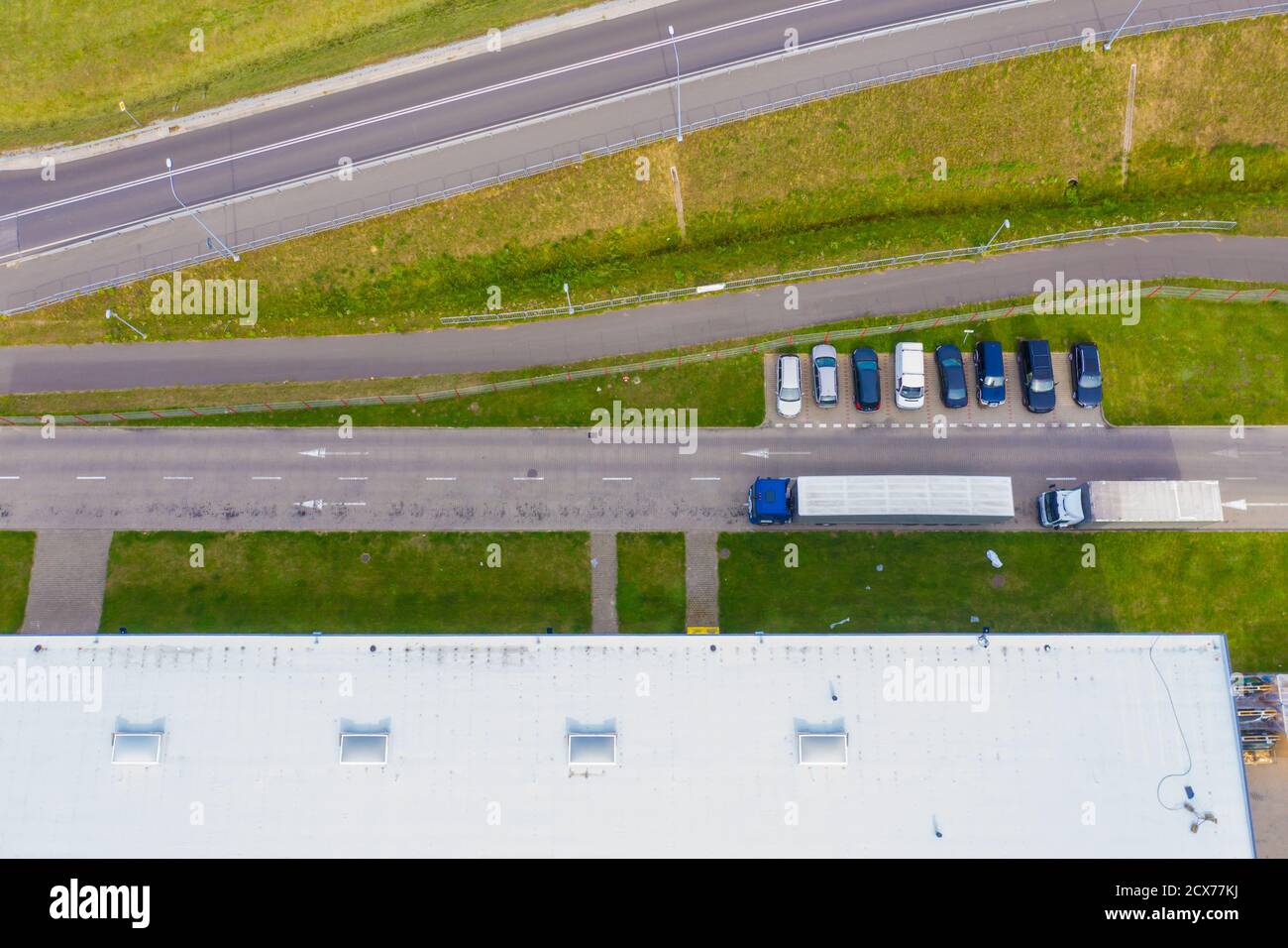 Aerial drone view of group of large modern industrial warehouse or ...