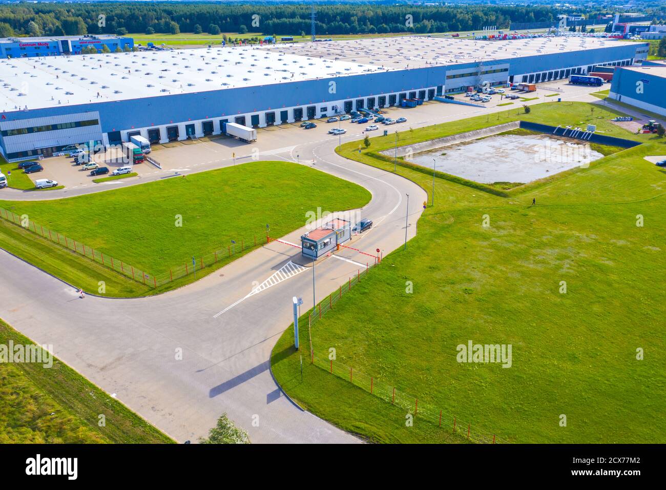 Aerial Shot of Industrial Loading Area where Many Trucks Are Unloading ...