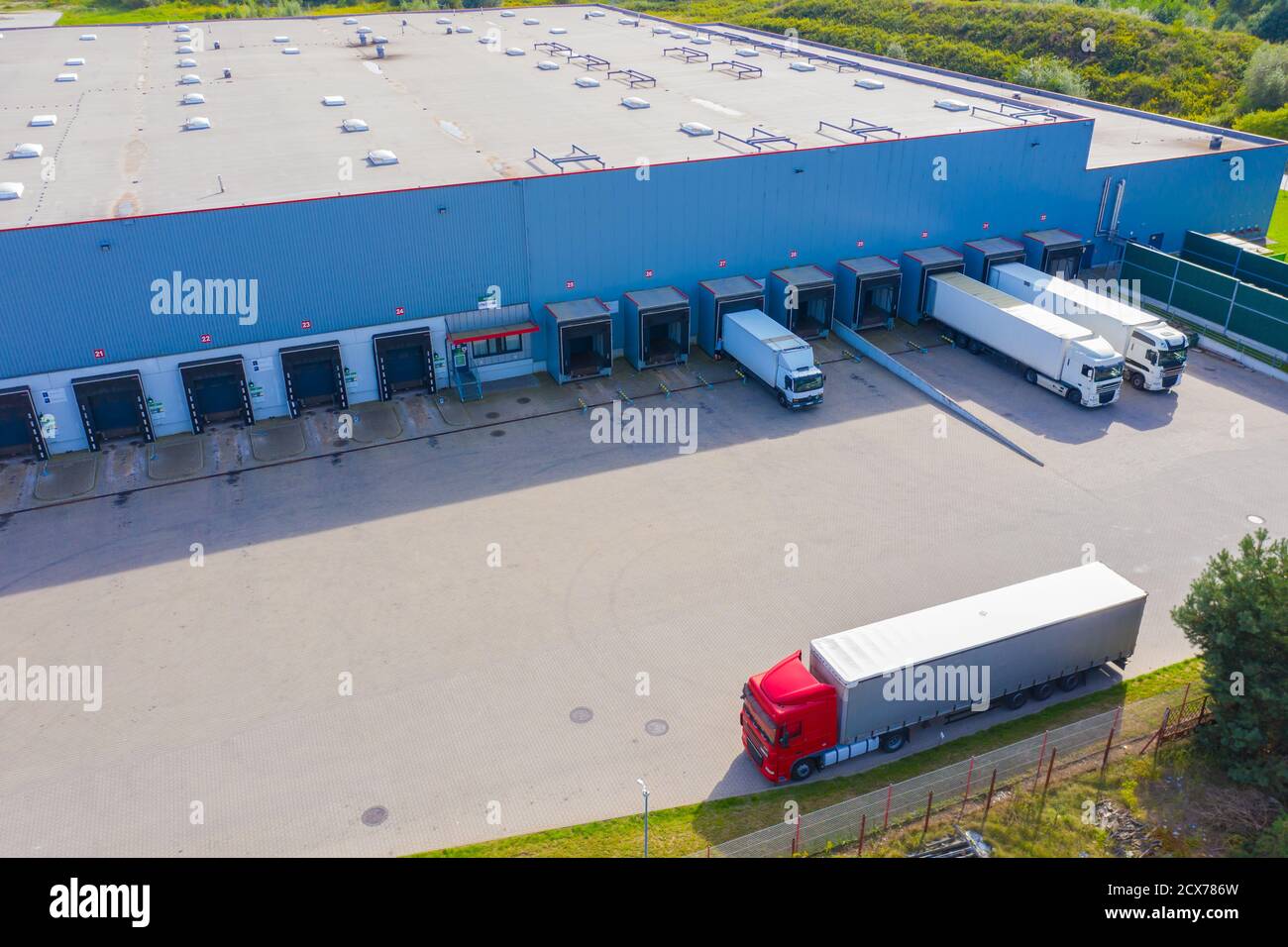 Aerial Shot of Industrial Loading Area where Many Trucks Are Unloading ...