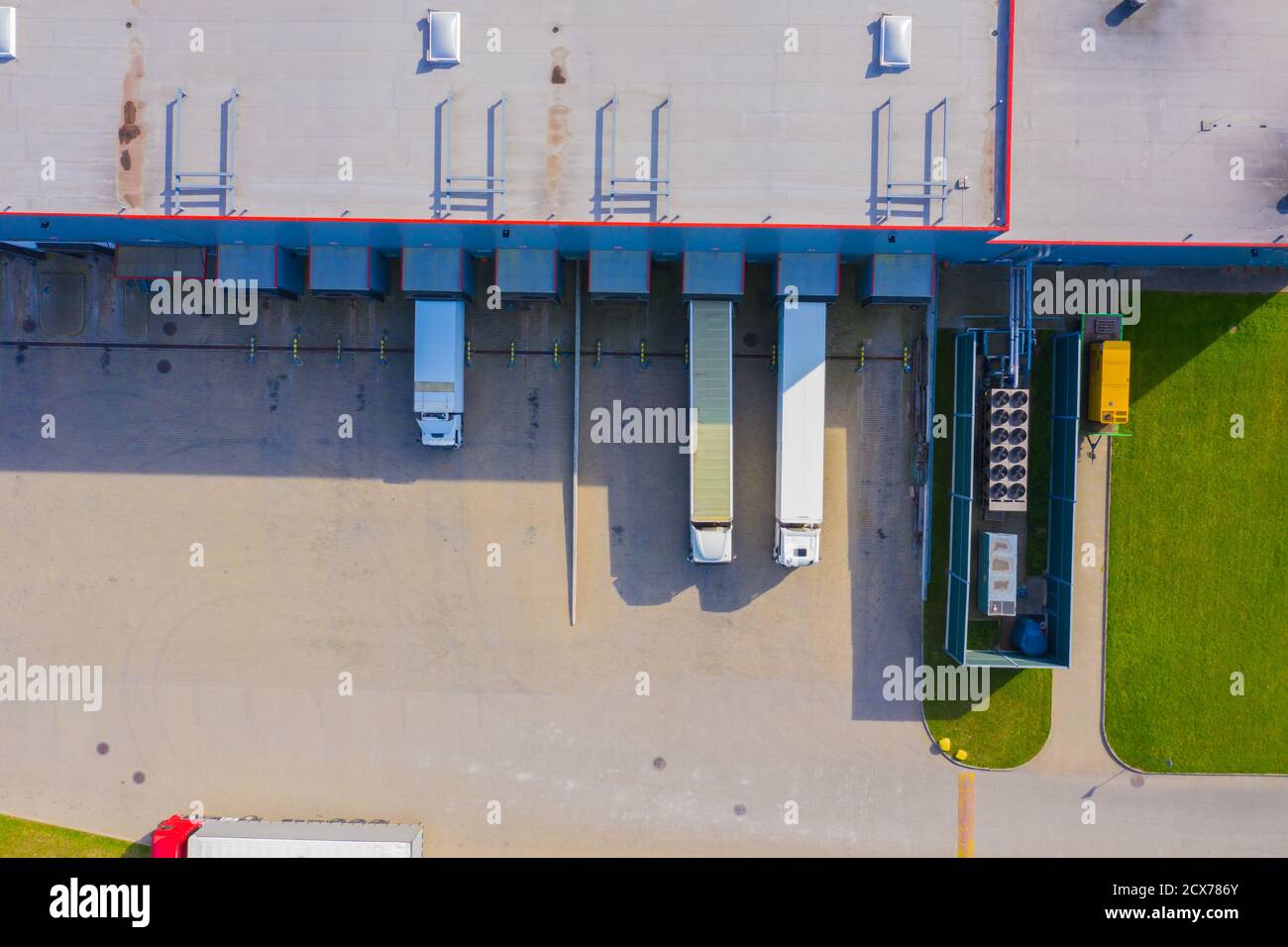 Aerial view of warehouse with trucks. Industrial background. Logistics ...