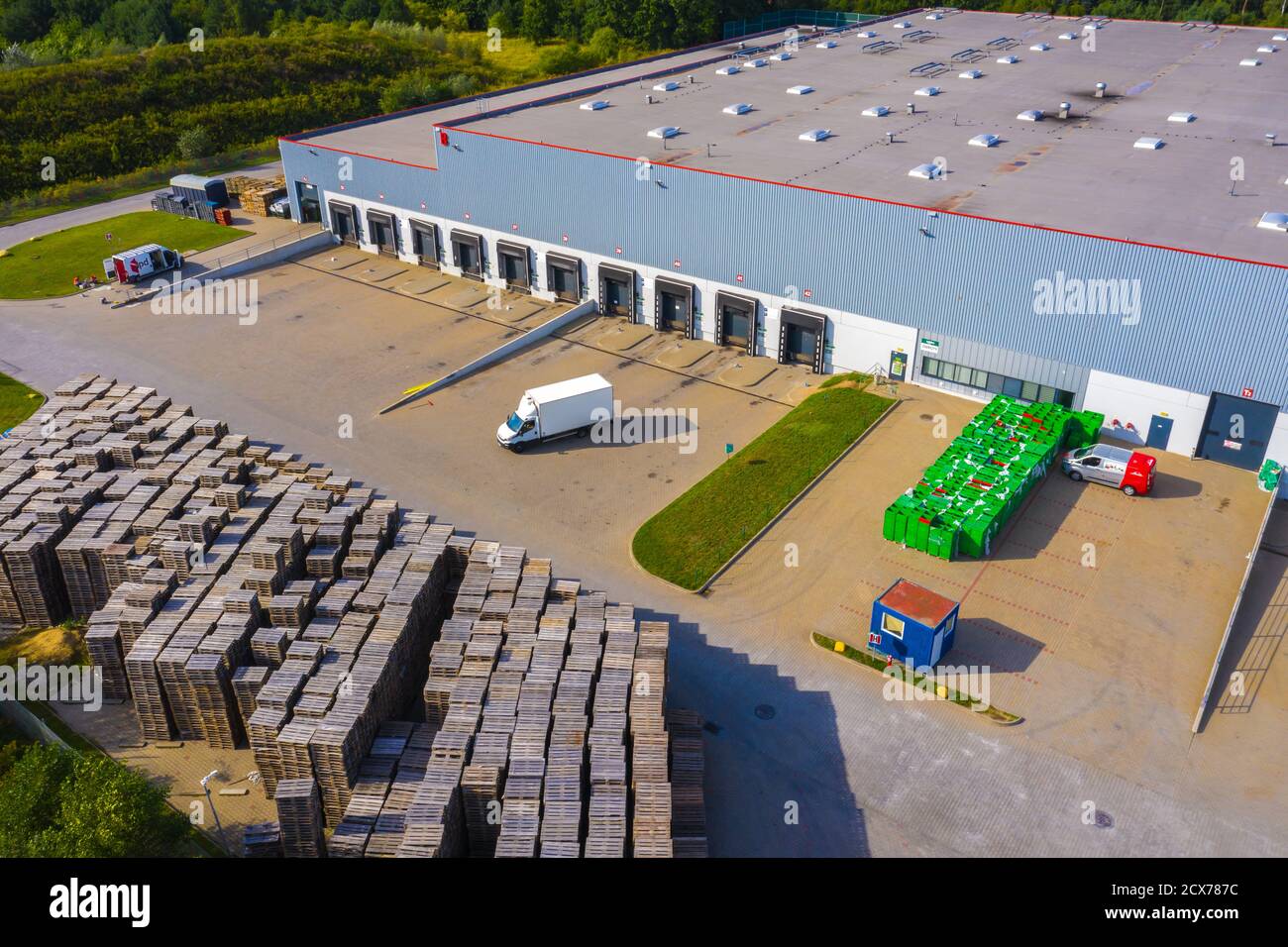 Aerial view of warehouse with trucks. Industrial background. Logistics ...