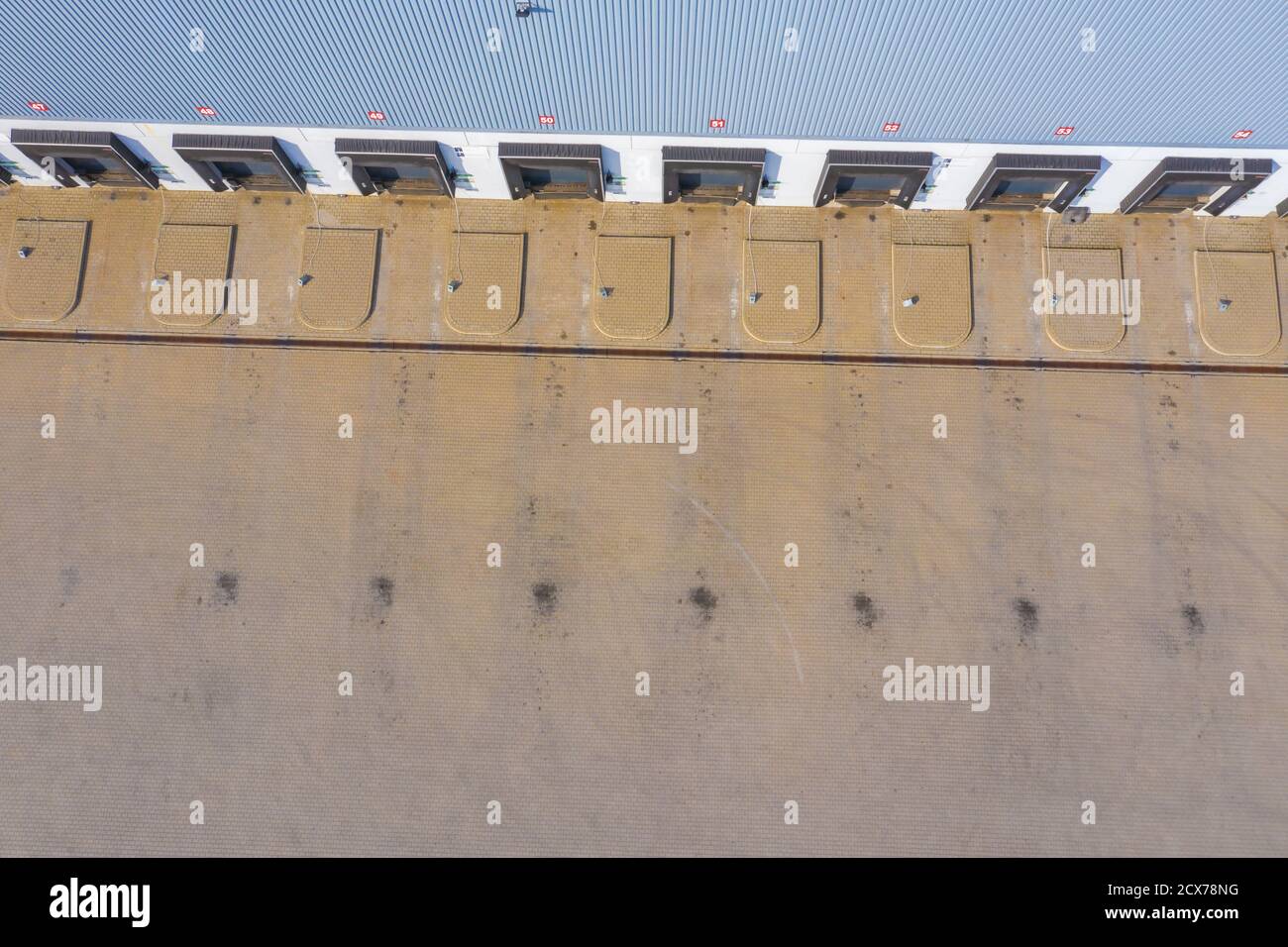 Aerial top view of truck and cargo trailer unloading in logostics ...