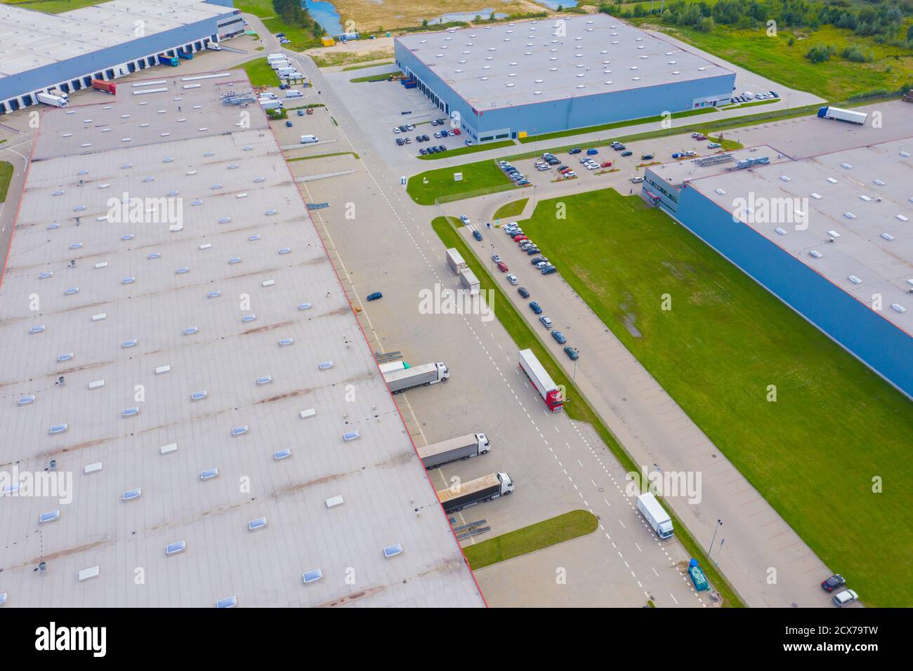 Aerial Shot of Industrial Warehouse Loading Dock where Many Truck with ...
