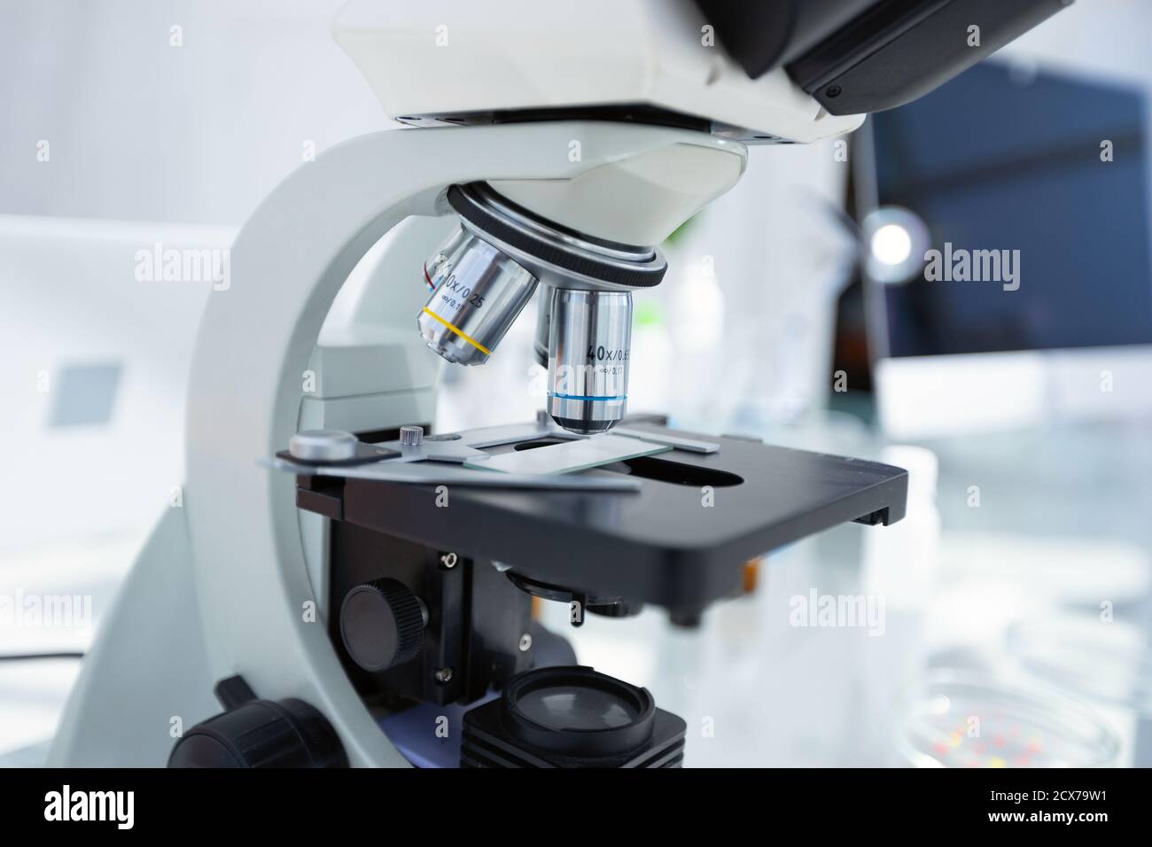 microscope is on the table in the lab. photo with a copy of the space ...