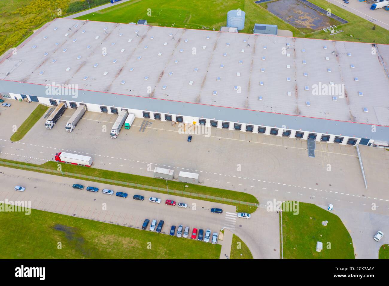 Aerial Shot of Industrial Warehouse Loading Dock where Many Truck with ...