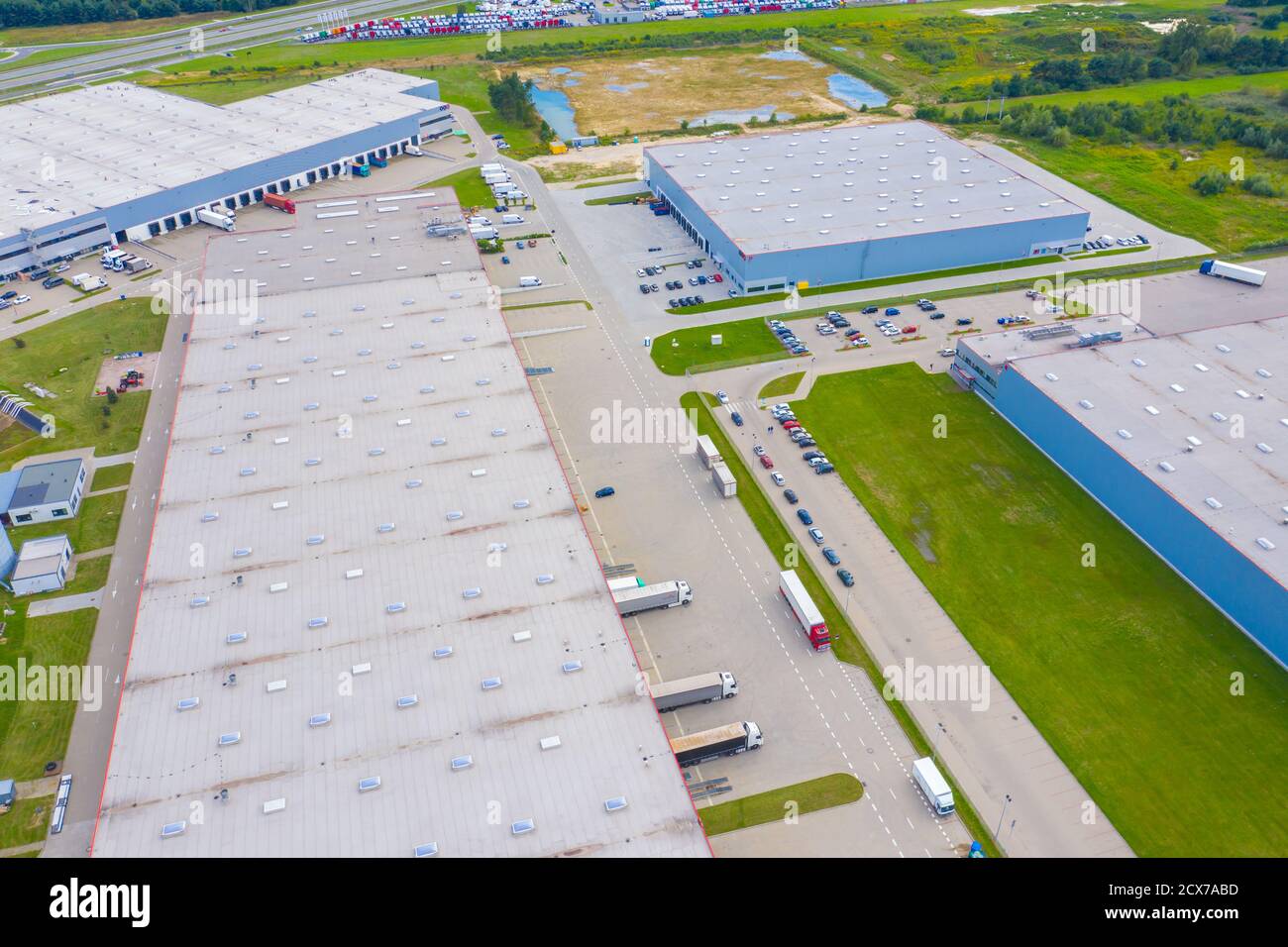 Aerial Shot of Industrial Warehouse Loading Dock where Many Truck with ...