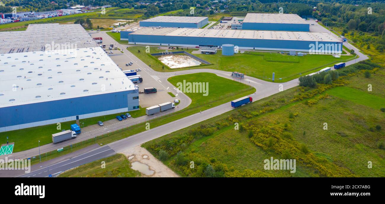 Aerial Shot of Industrial Warehouse Loading Dock where Many Truck with ...