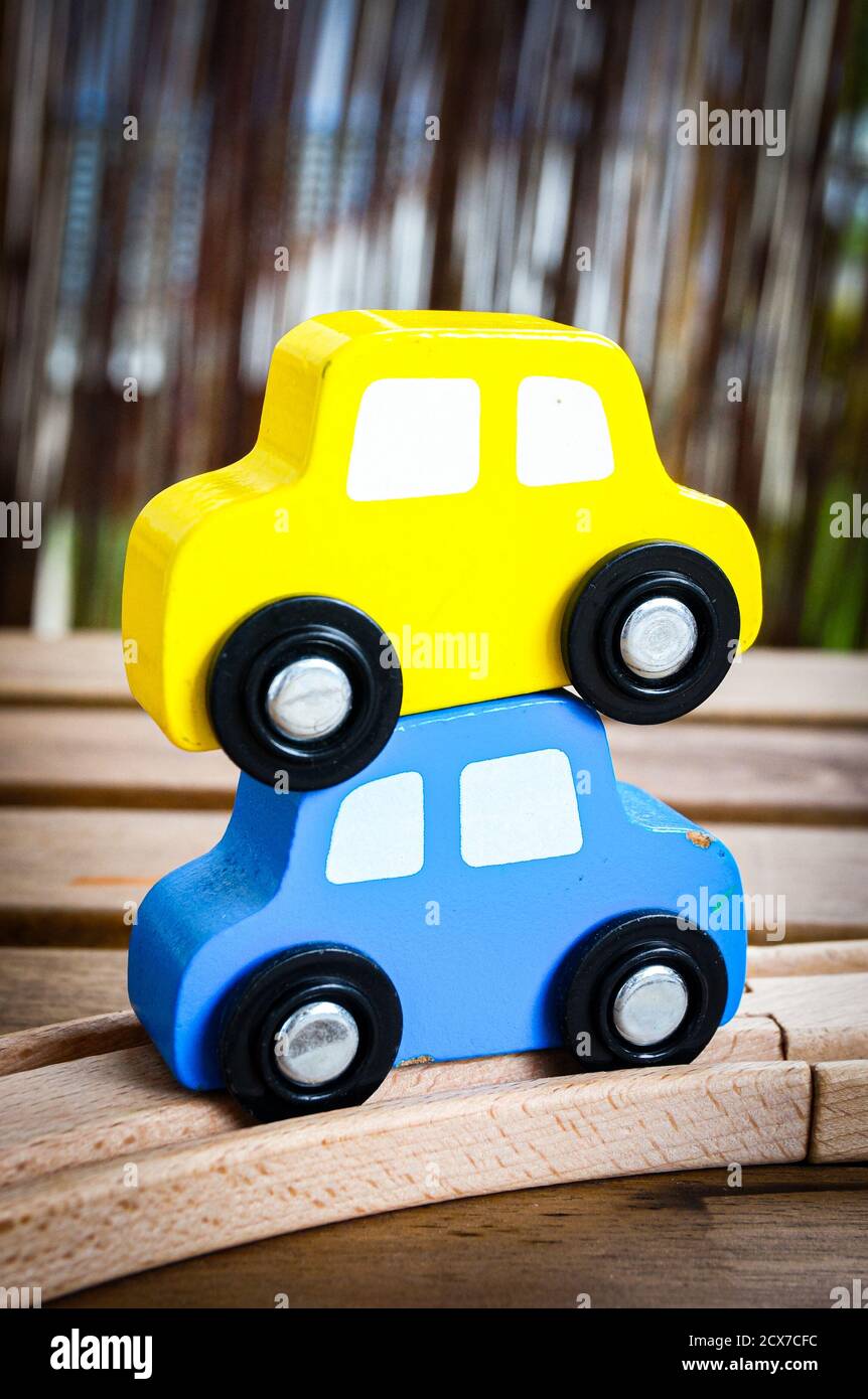 Vertical shot of toy cars on a wooden surface Stock Photo - Alamy