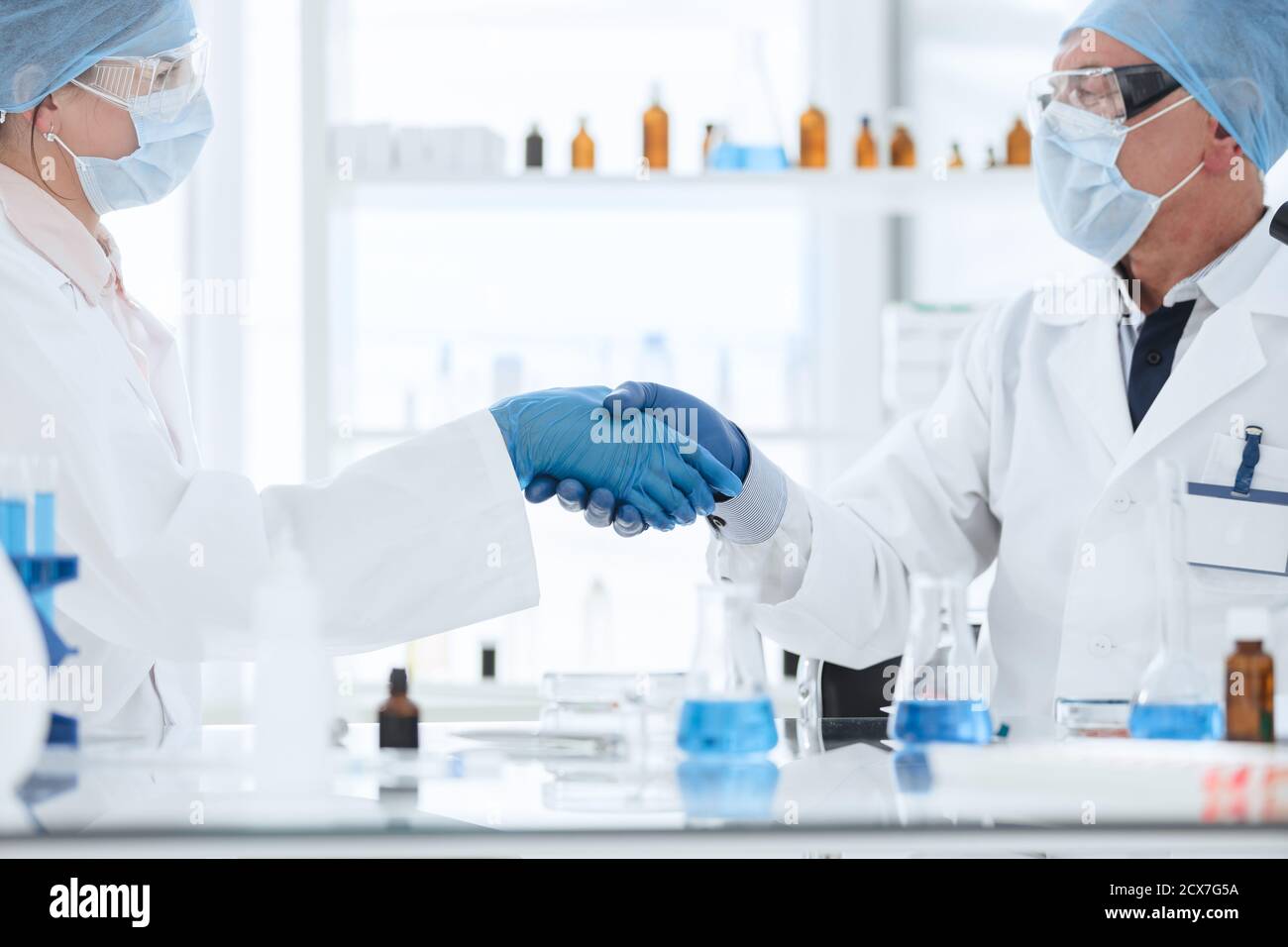 close up. Microbiology scientists shaking hands. science and health ...