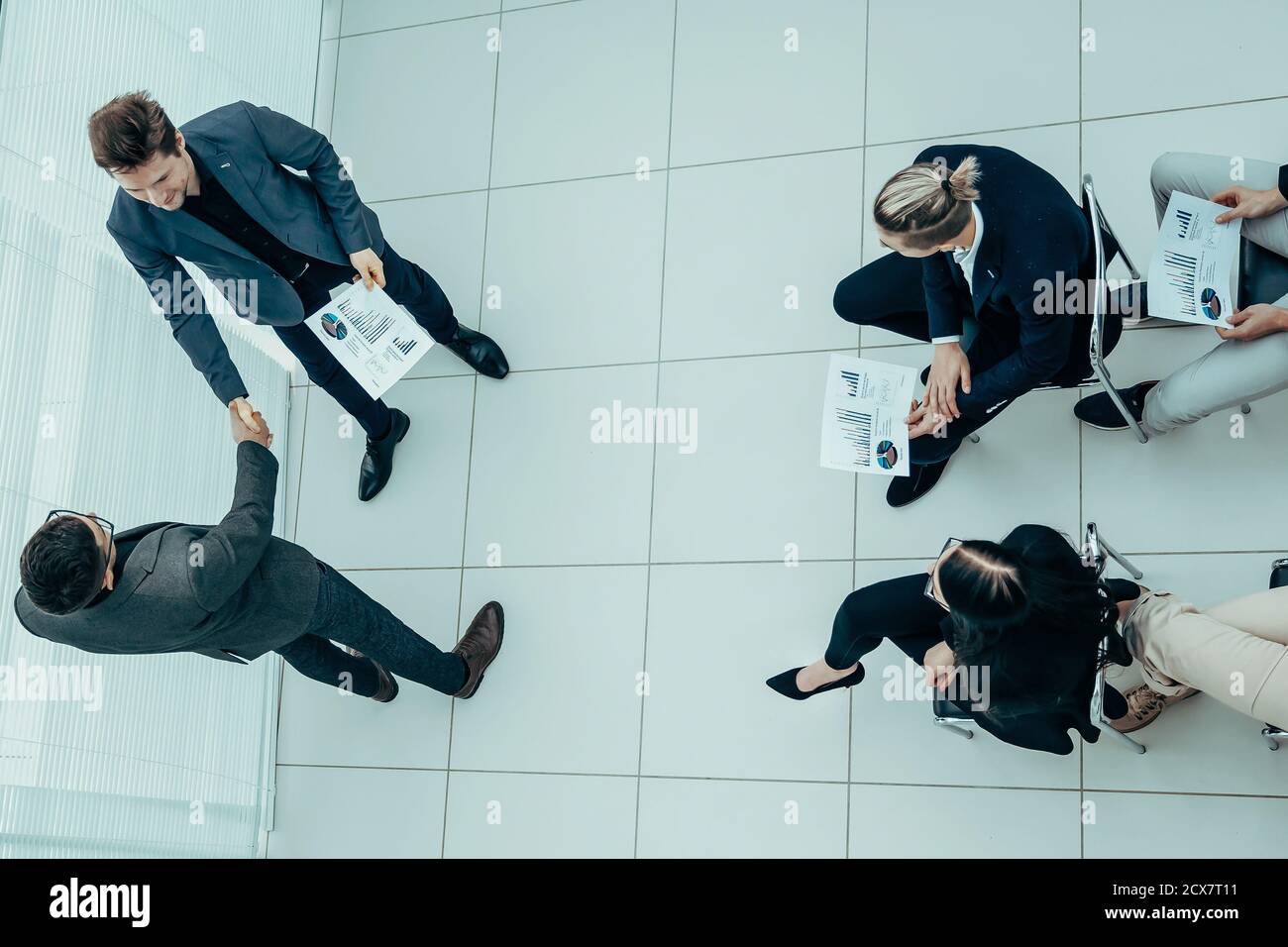 boss congratulates the employee on a good job Stock Photo - Alamy