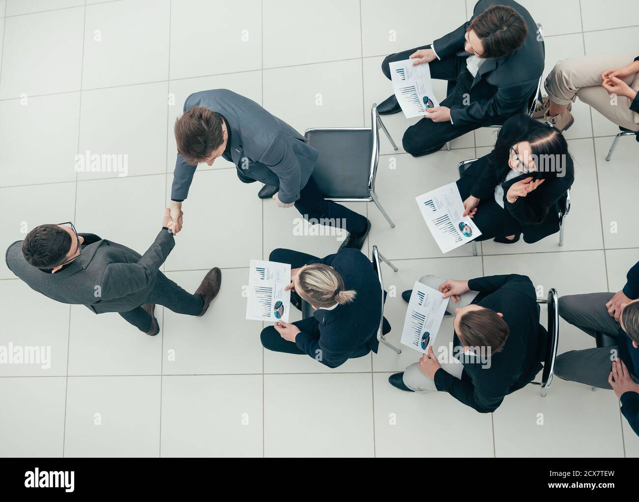 business colleagues supporting each other with a handshake Stock Photo ...