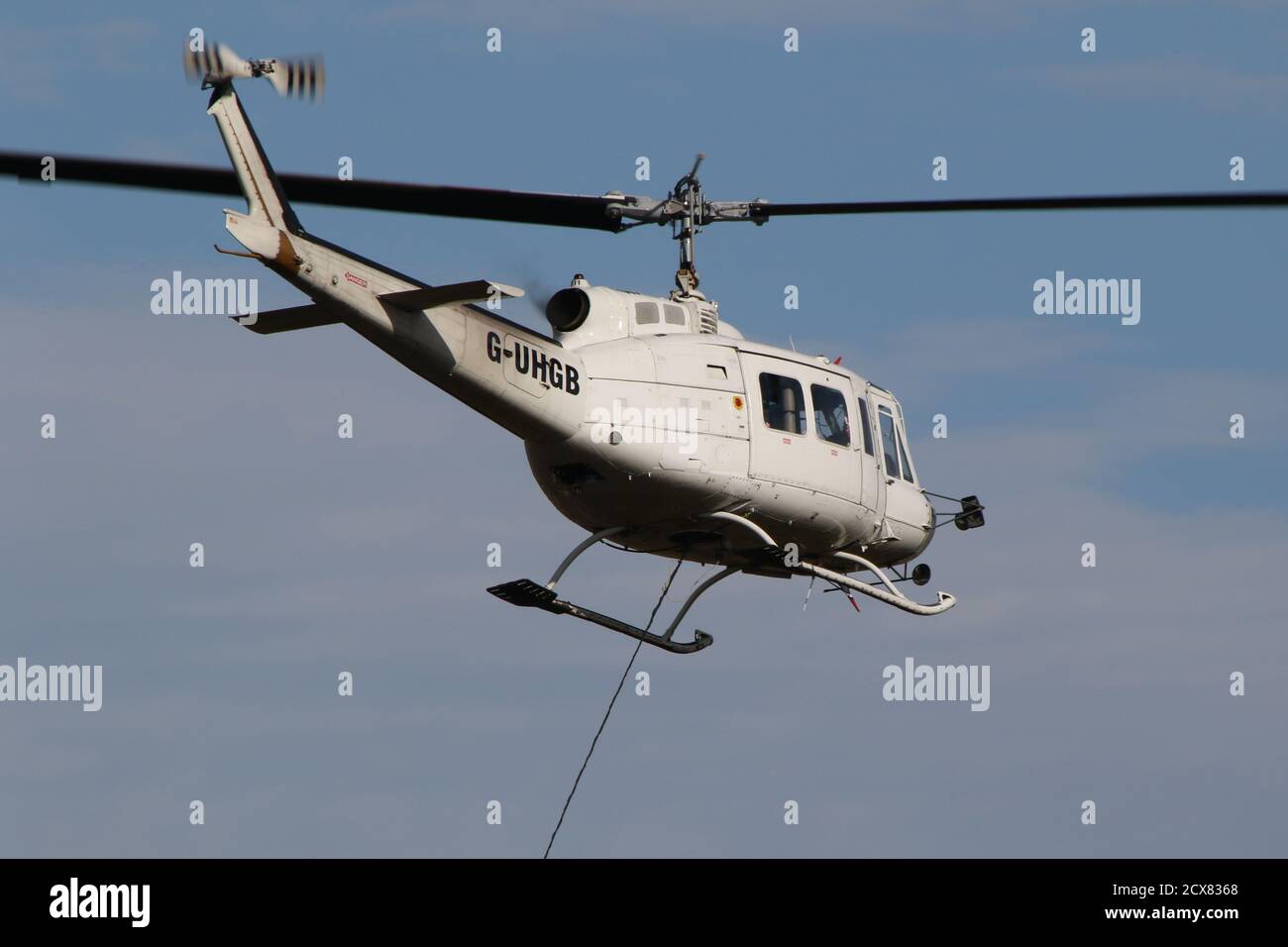 G-UHGB, a Bell 205A-1 operated by Heli-Lift Services, carrying out ...