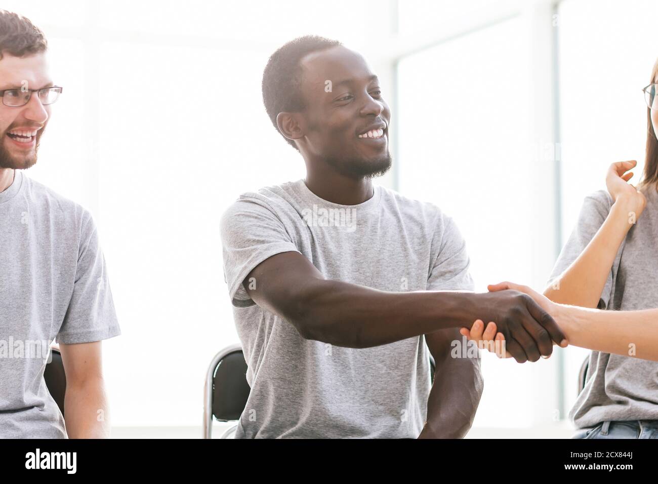 young people greeting each other with a handshake Stock Photo - Alamy young people greeting each other with a handshake Stock Photo - Alamy