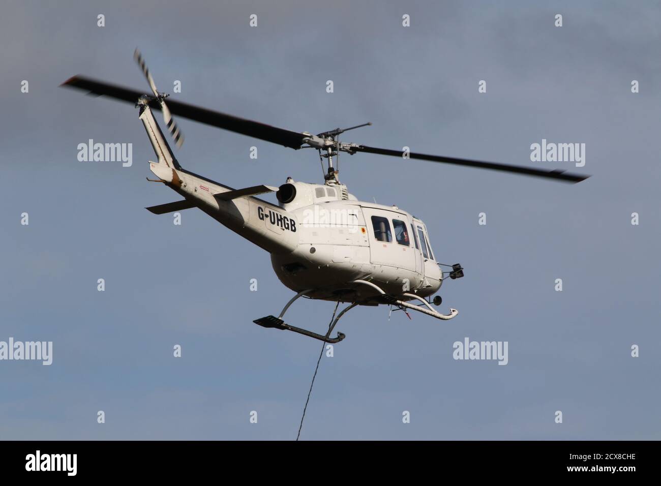 G-UHGB, a Bell 205A-1 operated by Heli-Lift Services, carrying out ...