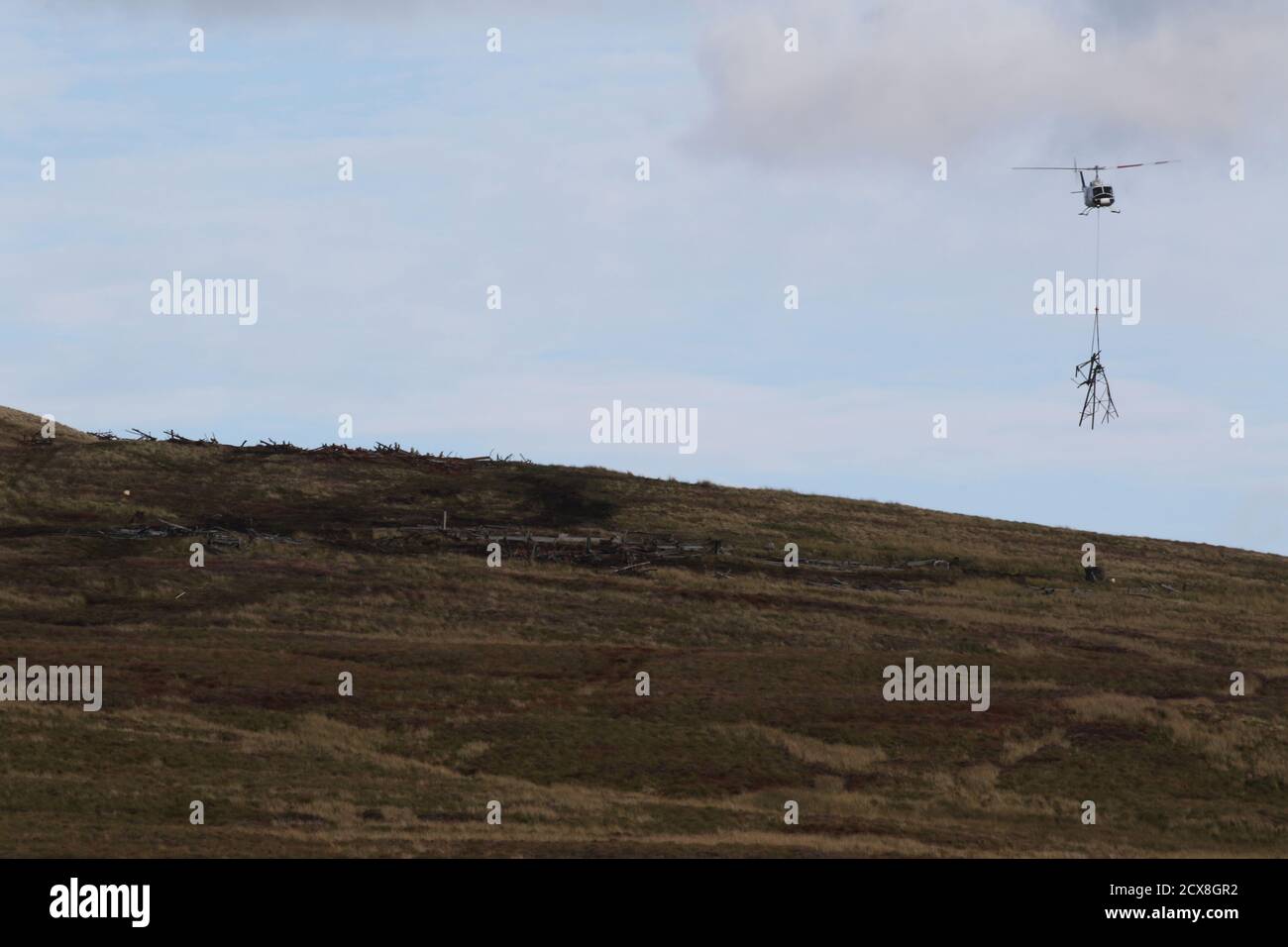 G-UHGB, a Bell 205A-1 operated by Heli-Lift Services, carrying out ...