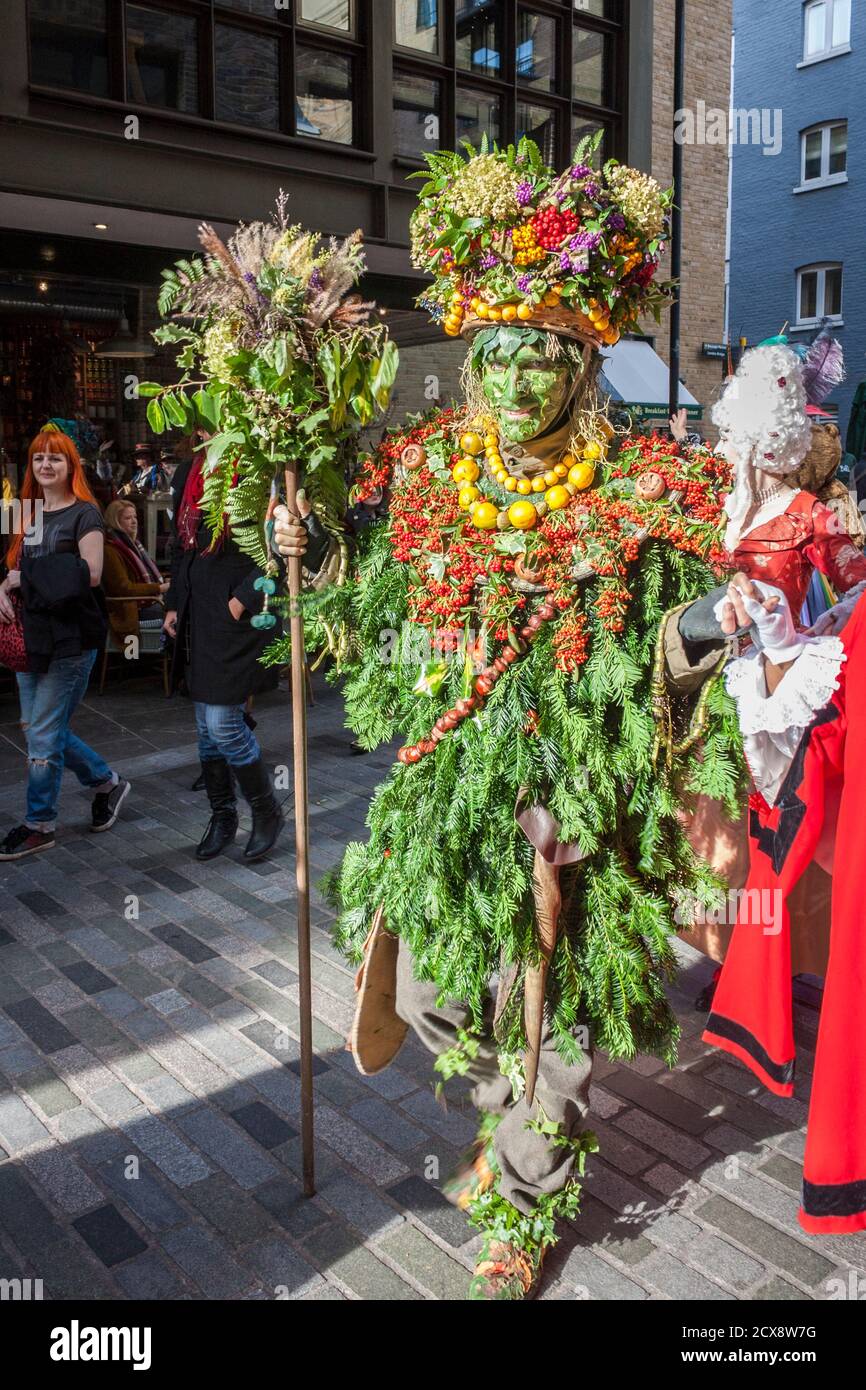 October Plenty autumnal procession, led by Berry Man. Bankside, London ...