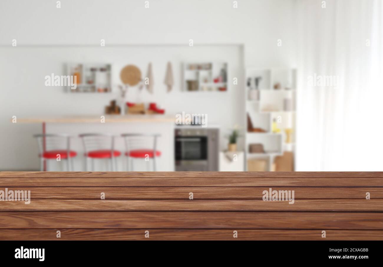 Empty wooden table in modern kitchen Stock Photo - Alamy