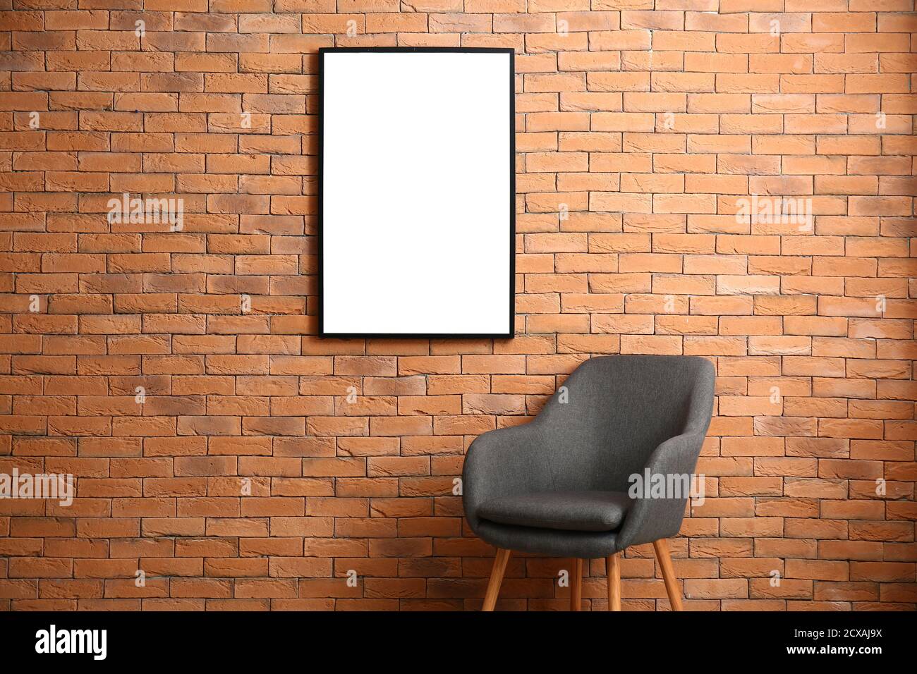 Blank poster with armchair in minimal interior of room Stock Photo - Alamy