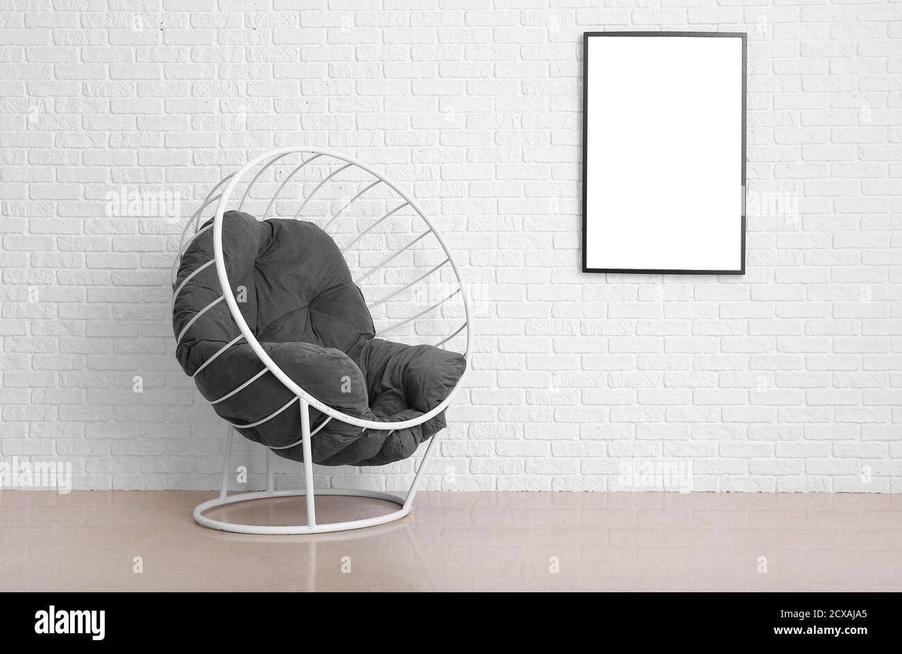 Blank poster with armchair in minimal interior of room Stock Photo - Alamy