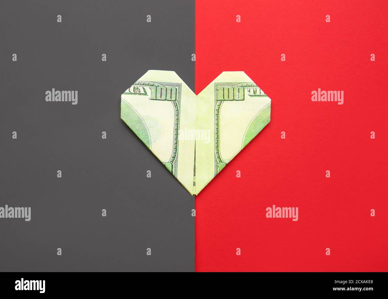 Origami heart made of dollar banknote on color background Stock Photo ...