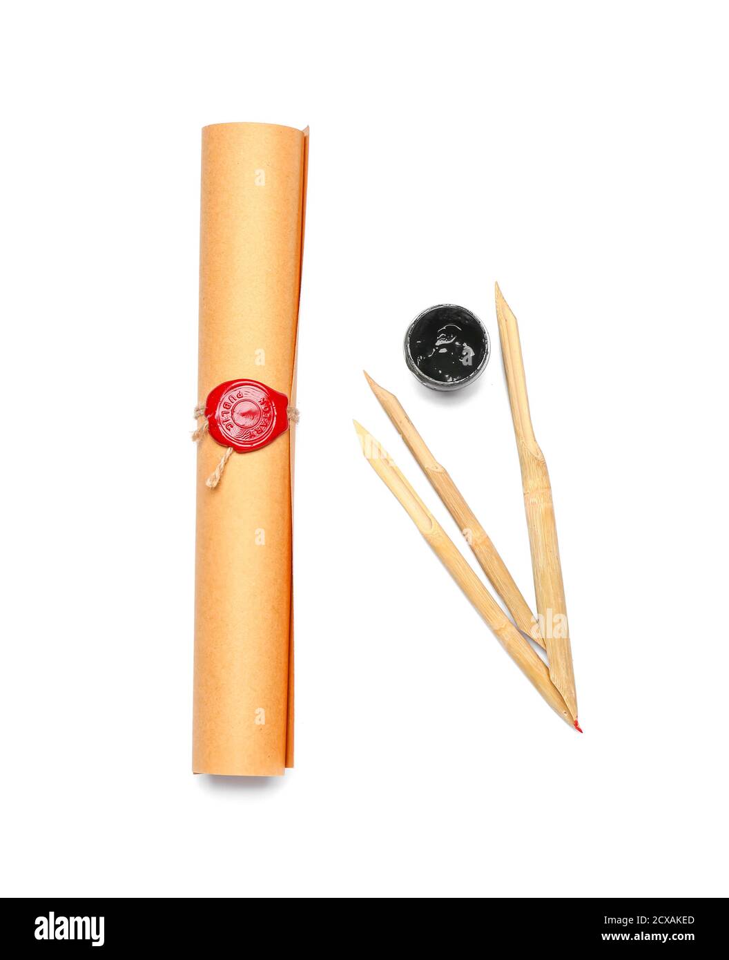 Scroll with dip pens and ink on white background Stock Photo - Alamy
