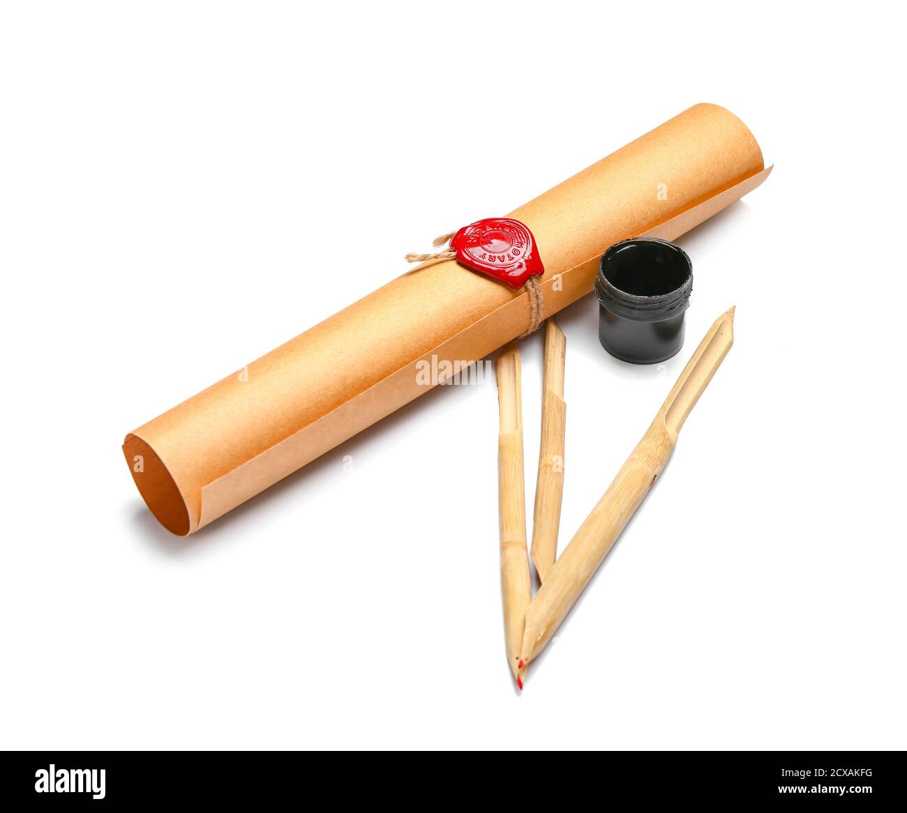 Scroll with dip pens and ink on white background Stock Photo - Alamy